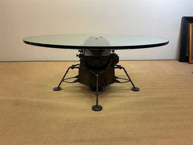 A bronze Apollo table by Mark Stoddart on artnet