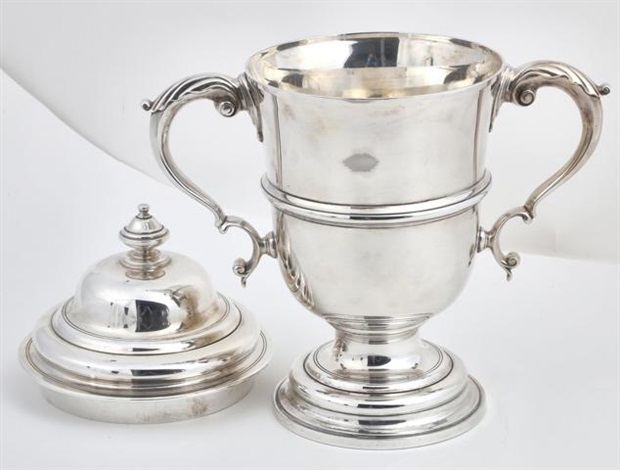 A Tiffany Co sterling silver two handled covered horse racing trophy ...