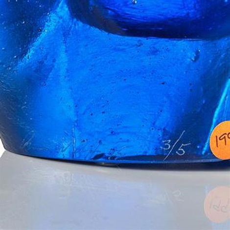A blue cast glass Head Series P4 sculpture by Ann Wolff on artnet