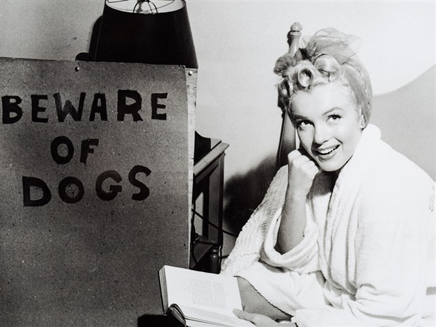 Marilyn Monroe Reading A Book by Jock Carroll on artnet
