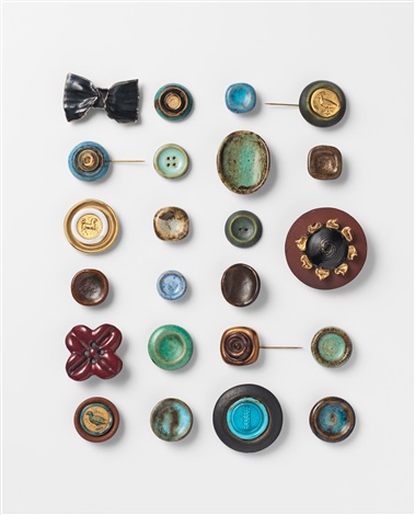 Twenty-three buttons and stick pins by Lucie Rie on artnet