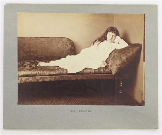 a photograph of Alexandra Xie Kitchen reclining on a sofa by Lewis ...