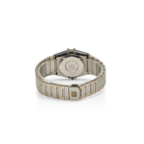 A STAINLESS STEEL AND GOLD QUARTZ BRACELET WATCH by OMEGA SA on artnet