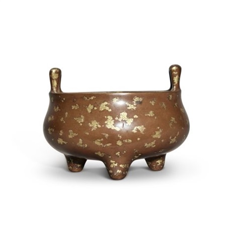 A gold-splashed bronze tripod censer on artnet