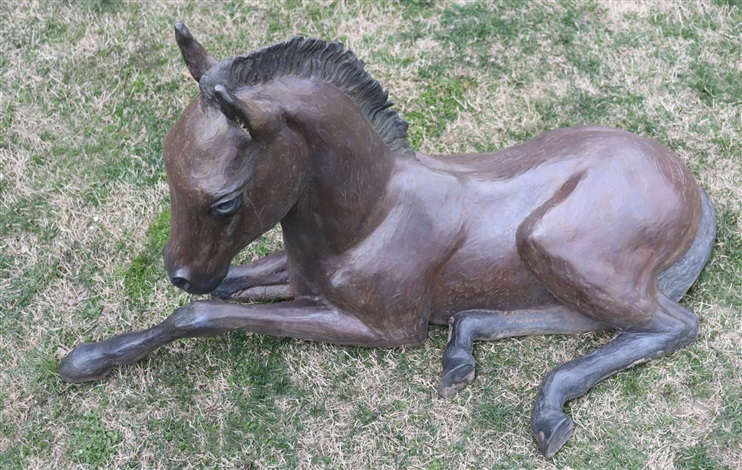 Recumbent foal life size bronze sculpture by Pat Mathiesen on artnet