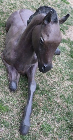 Recumbent foal life size bronze sculpture by Pat Mathiesen on artnet