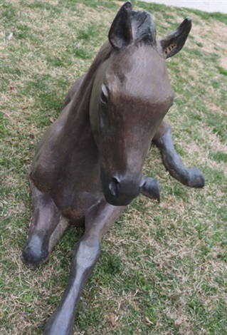 Recumbent foal life size bronze sculpture by Pat Mathiesen on artnet