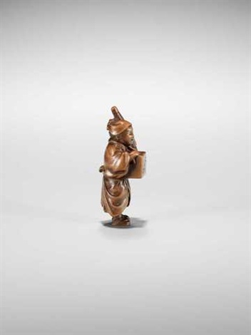 MASANAO A SMALL WOOD NETSUKE OF A BEAN VENDOR. Japan, Yamada, Ise ...