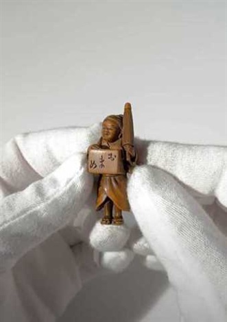 MASANAO A SMALL WOOD NETSUKE OF A BEAN VENDOR. Japan, Yamada, Ise ...
