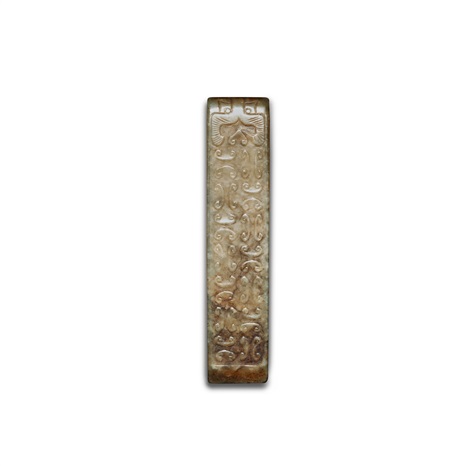 An archaistic brown and beige jade scabbard slide, Late Qing dynasty on ...