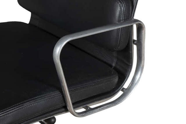 A soft pad chair by Eames for ICF on five castors with adjustable seat ...