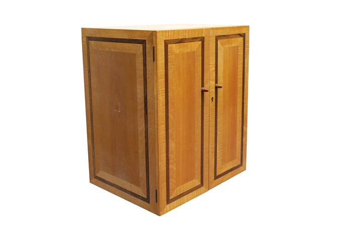 A two-door cabinet by David Linley on artnet