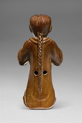 A WOOD CARVED NETSUKE OF A SEATED CHINESE FEMALE. SHOWA PERIOD 20TH ...