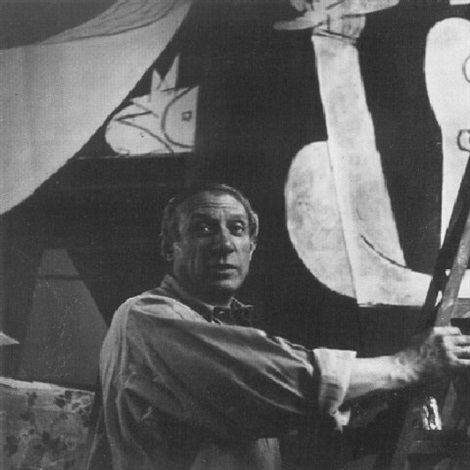 Picasso dans son atelier des Grands-Augustins sur un escabeau, devant Guernica by Dora Maar on ...