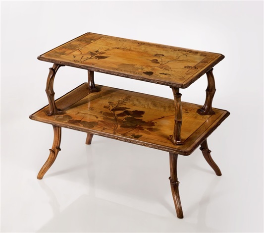 A RARE TWO-TIER TEA TABLE by Émile Gallé on artnet