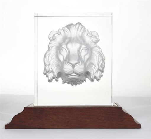 A Steuben clear glass sculpture Regal Lion, designed by Peter Drobny ...