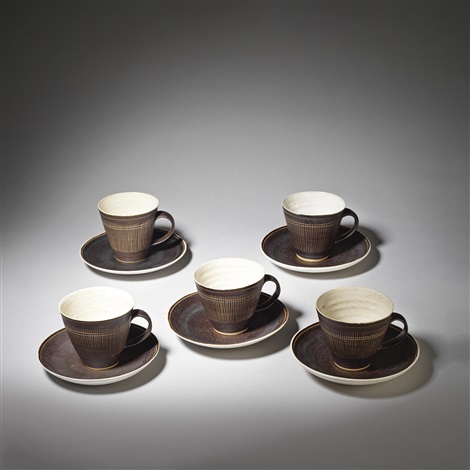 Five cups and saucers by Lucie Rie on artnet