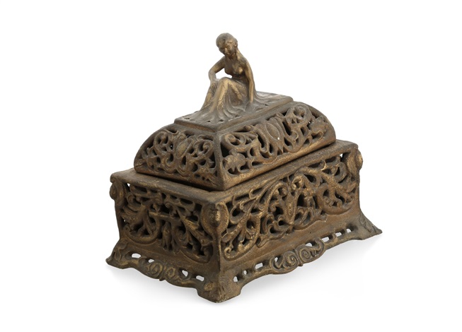 Reticulated scroll body with a domed cover surmounted by a seated ...