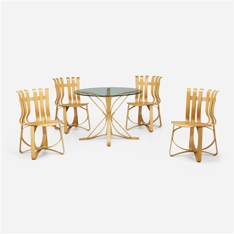 Face Off table and Ribbon chairs, set of our by Frank Gehry on artnet