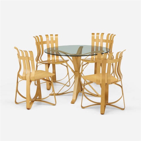 Face Off table and Ribbon chairs, set of our by Frank Gehry on artnet