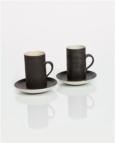 A pair of stoneware coffee cups and saucers by Lucie Rie on artnet