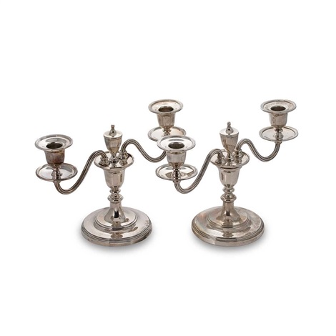 A visual pair of Elizabeth II silver two light metamorphic candelabra ...