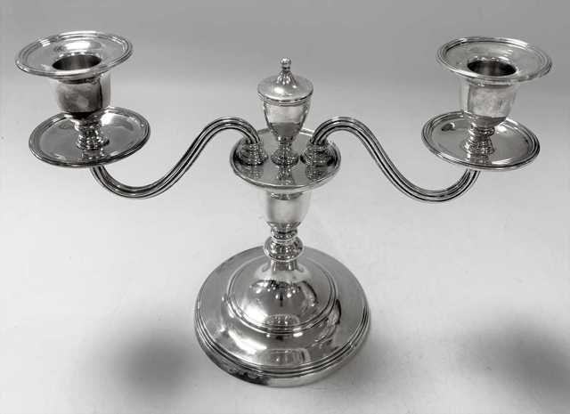 A visual pair of Elizabeth II silver two light metamorphic candelabra ...