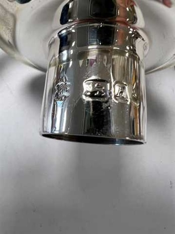 A visual pair of Elizabeth II silver two light metamorphic candelabra ...