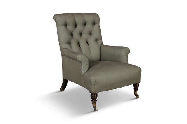 A BUTTON BACK ARMCHAIR by Howard & Sons on artnet