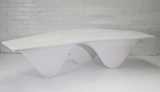 A white Aqua table by Zaha Hadid on artnet