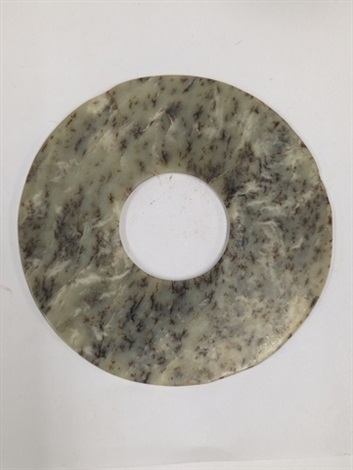 A CHINESE ARCHAIC MOTTLED JADE DISC, BI. Neolithic Period, Qijia ...