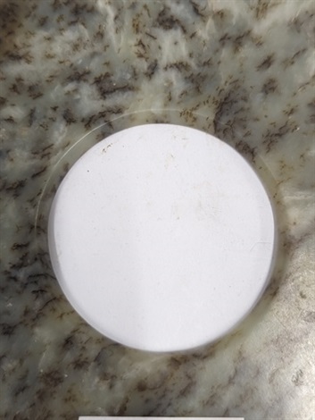 A CHINESE ARCHAIC MOTTLED JADE DISC, BI. Neolithic Period, Qijia Culture Circa 2300 - 1500 B.C.E ...