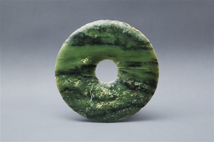 A CHINESE ARCHAIC MOTTLED GREEN JADE DISC, BI. Neolithic Period on artnet