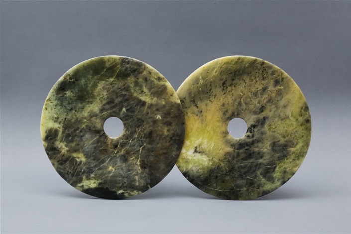 TWO CHINESE ARCHAIC GREEN JADE DISCS, BI. Neolithic Period or later on ...