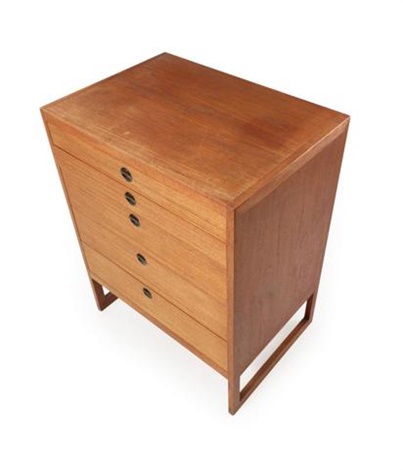 A teak chest of drawers, front with five drawers, round brass handles ...