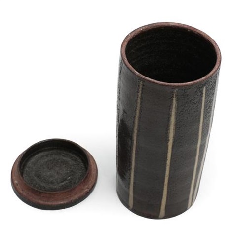 A cylinder shaped high fired earthenware lid jar, decorated with ...