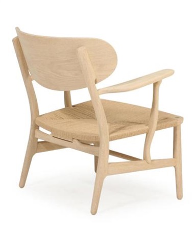 CH 22 An easy chair with oak frame and moulded back, seat with woven ...
