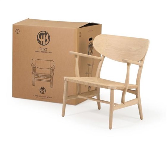 CH 22 An easy chair with oak frame and moulded back, seat with woven ...