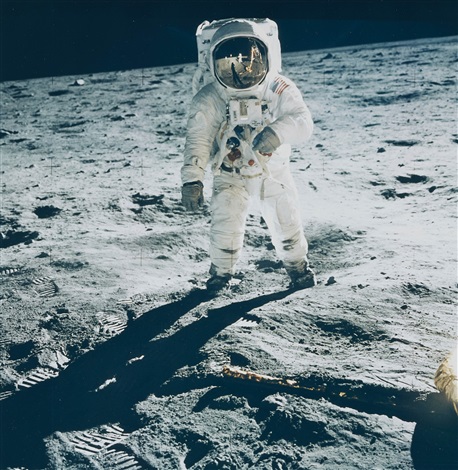 Astronaut Edwin E. Aldrin Jr. walks on the surface of the moon near the ...