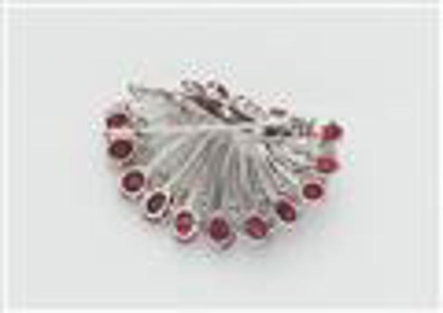 A French 18k white gold diamond and carved ruby Retro style brooch ...