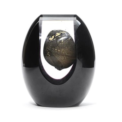 A clear glass sculpture with black overlay and dark glass element ...