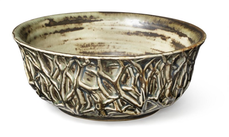 A circular stoneware bowl, exterior modelled with relief branch decor ...