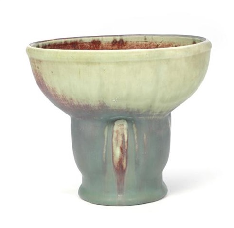 A round stoneware vase, top modelled with four holes for flowers by ...
