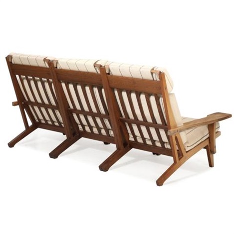 GE 375 A three seater oak sofa by Hans J. Wegner on artnet
