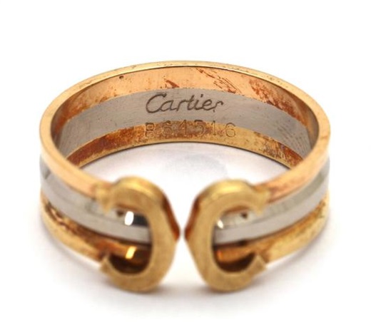 A Double C ring of 18k tri-coloured gold by Cartier (Co.) on artnet