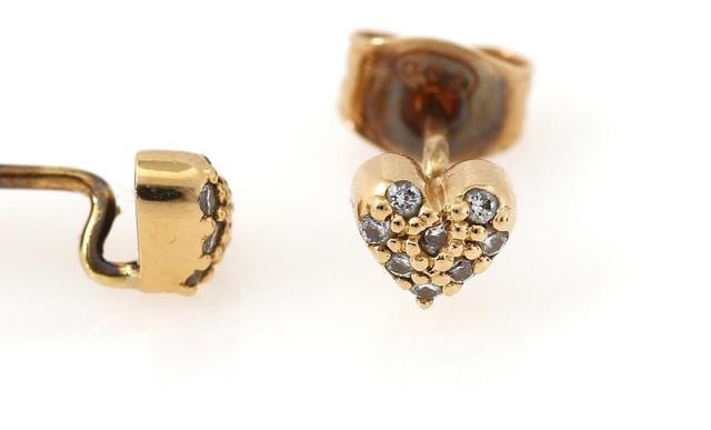 A pair of heart-shaped earrings by Ole Lynggaard on artnet