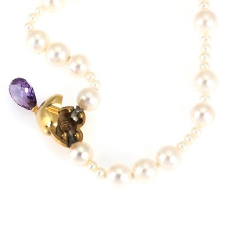 A diamond and amethyst clasp in the shape of a heart by Ole Lynggaard ...