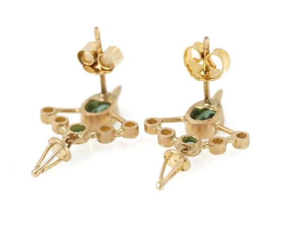 A pair of ear pendants each set with an oval-cut tourmaline, a circular ...