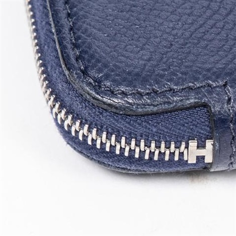 A wallet of dark blue Epsom leather by Hermès (Co.) on artnet