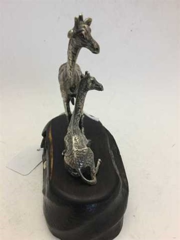 A Pair of Zimbabwean Silver Models of Giraffe by Patrick Mavros on artnet